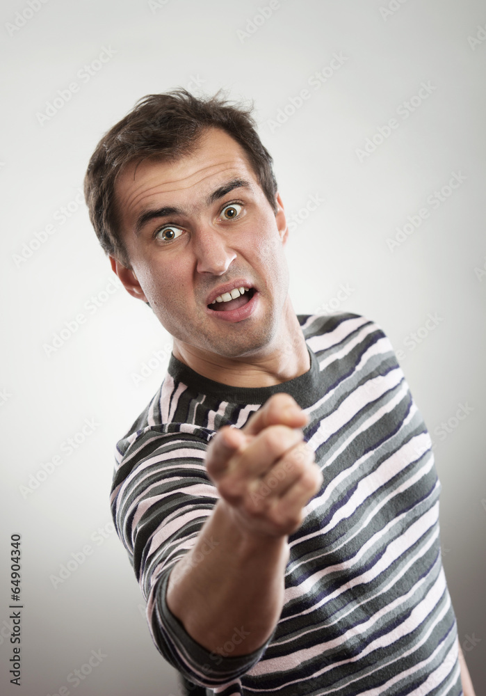 Angry man pointing at camera, studio shot Stock Photo | Adobe Stock