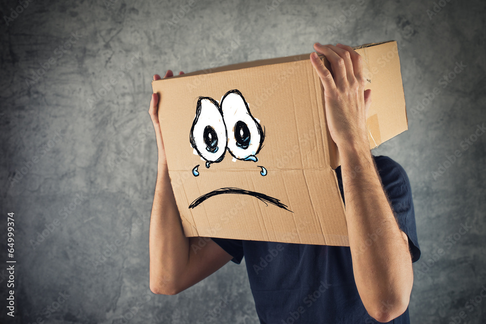 Man with cardboard box on his head and sad face expression Stock Photo ...