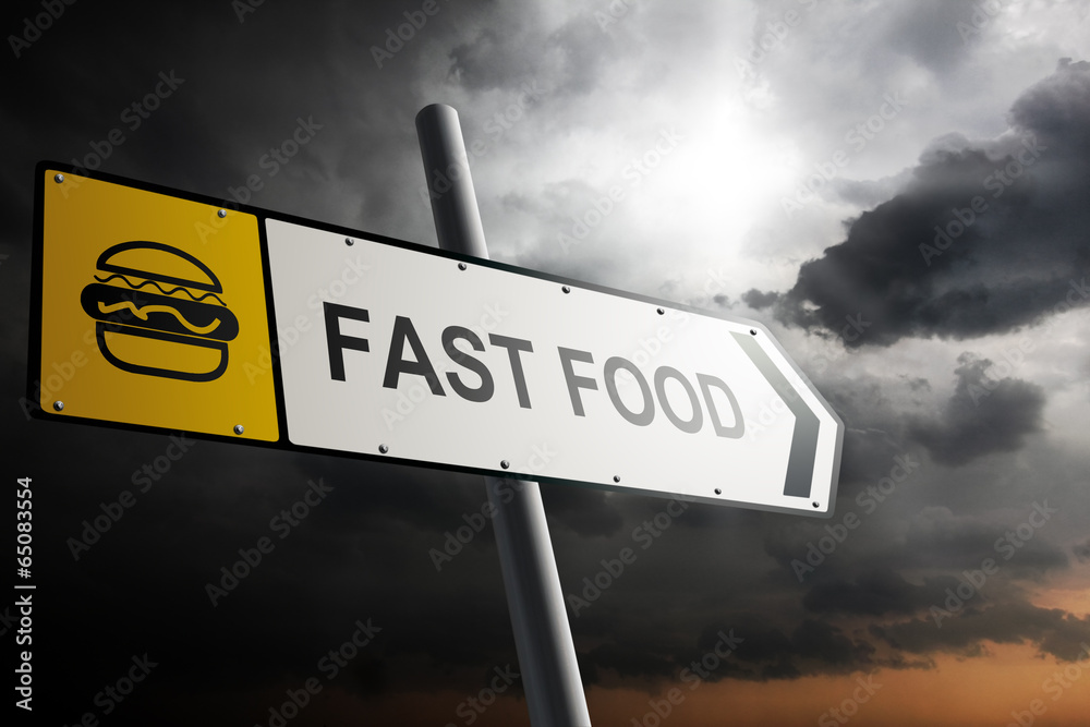 Fast food direction. Yellow traffic sign. Stock Photo | Adobe Stock