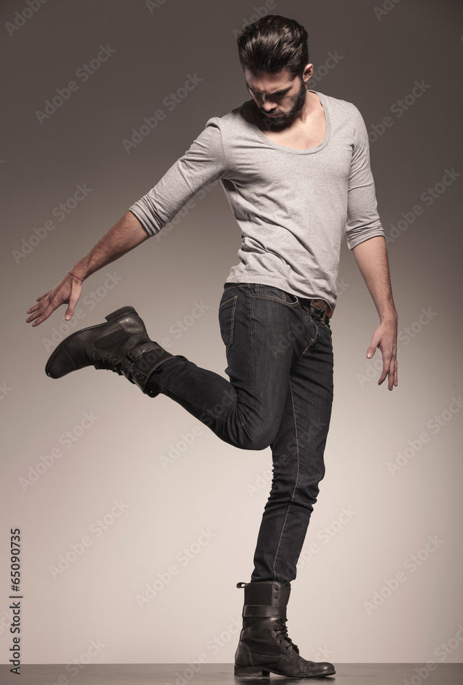 playful young fashion model in a dynamic pose Stock Photo | Adobe Stock