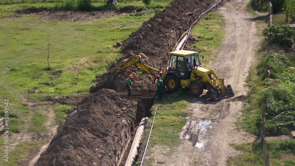 Excavator backfill the trench with new water pipe Stock 비디오 | Adobe Stock