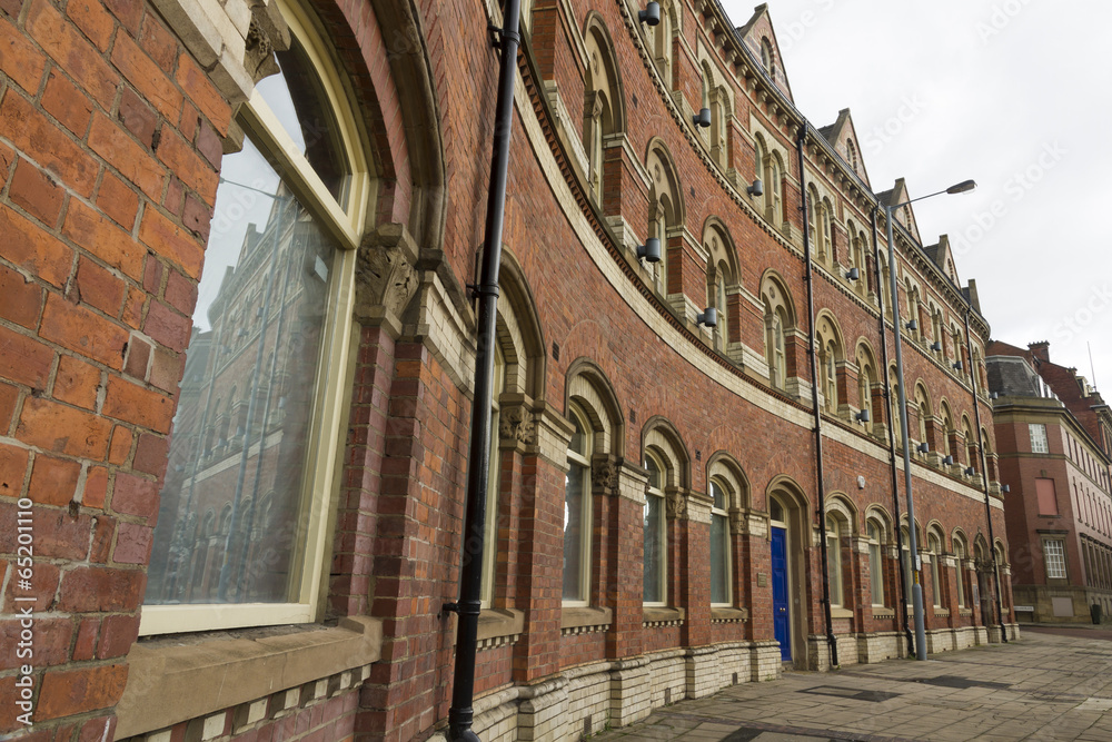 Victorian red brick three storey row in street. Stock Photo | Adobe Stock