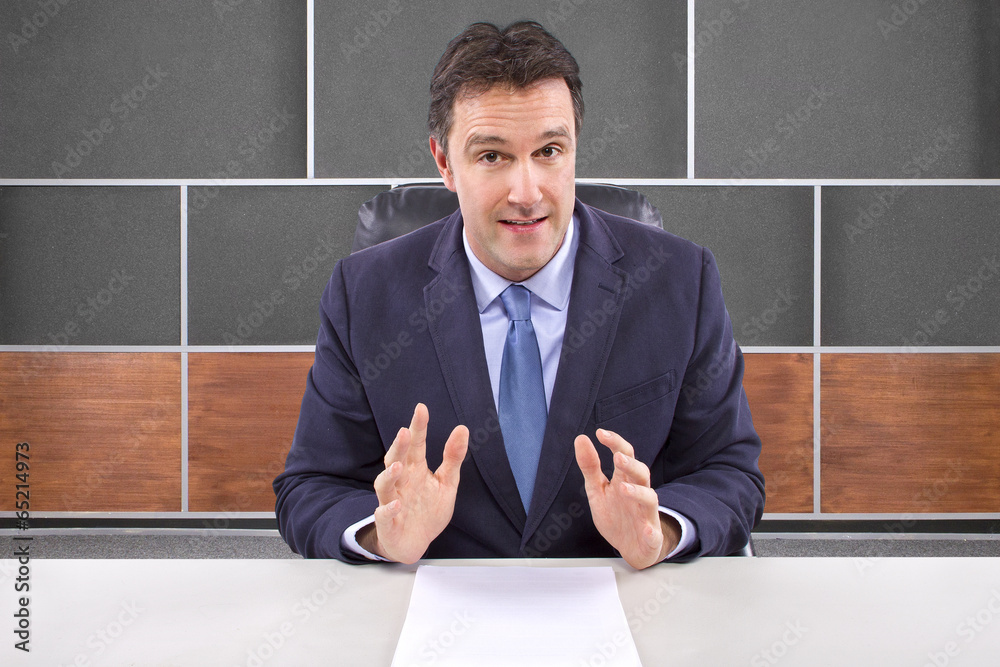 male news anchor or reporter in a studio set Stock Photo | Adobe Stock