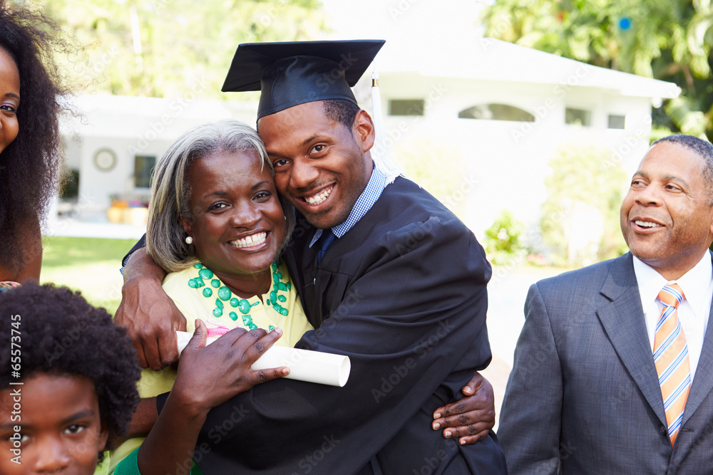 Student Celebrates Graduation With Parents Stock Photo | Adobe Stock