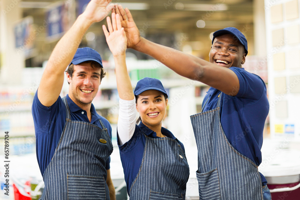 group of hardware store workers high five Stock Photo | Adobe Stock