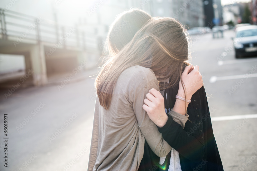 Two Sad Girls Hugging