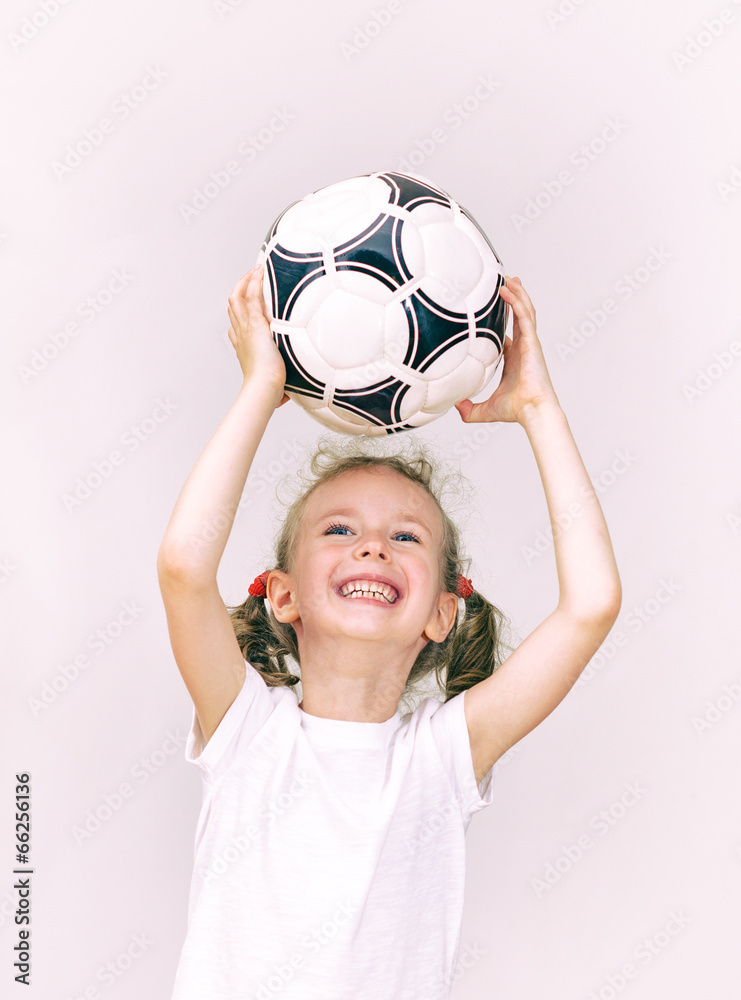 Little girl catches the ball. Stock Photo | Adobe Stock
