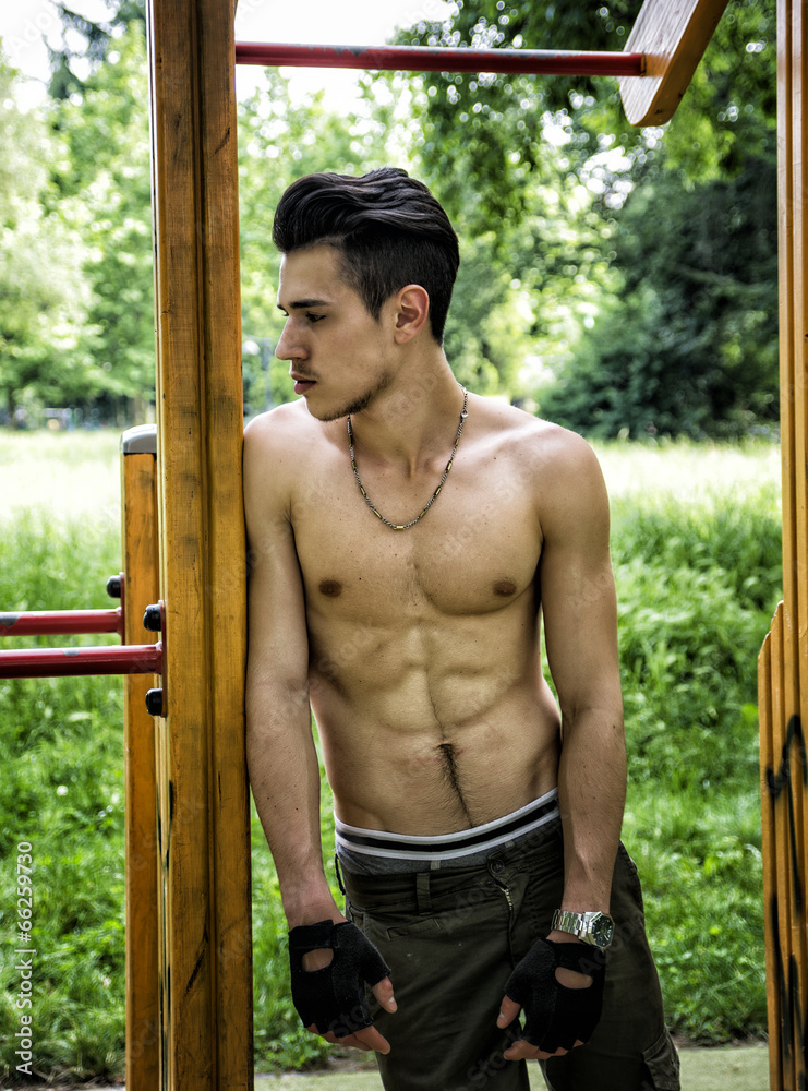 Handsome Shirtless Young Man Exercising In Outdoor Gym In Park Stock