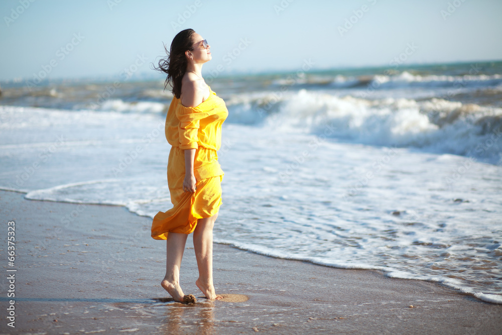 Woman at the beach Stock Photo | Adobe Stock