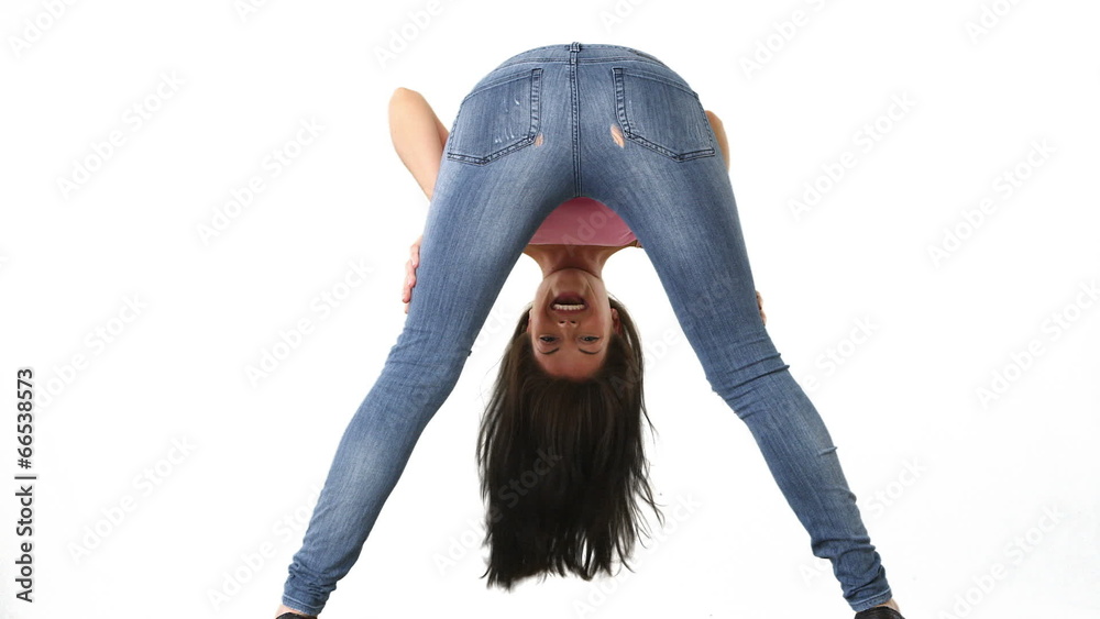 Back view of young woman in tight jeans bending over and smiling Stock 비디오 | Adobe Stock