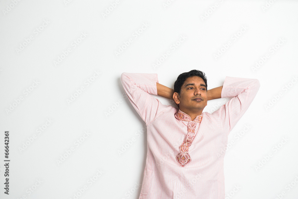 young indian man with relaxed pose and traditional dress Stock Photo ...