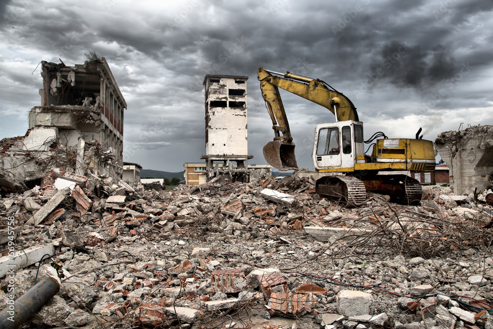 Bulldozer removes the debris from demolition of old buildings Stock ...