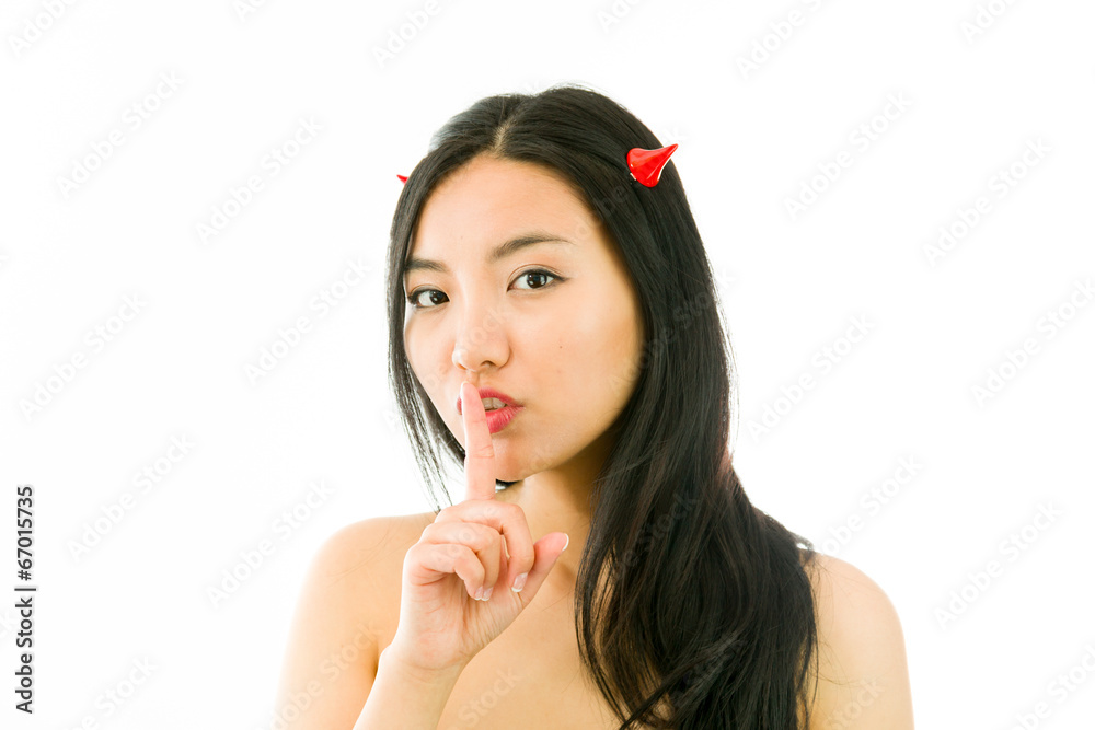 Devil side of a young Asian naked woman with finger on lips Stock Photo | Adobe Stock