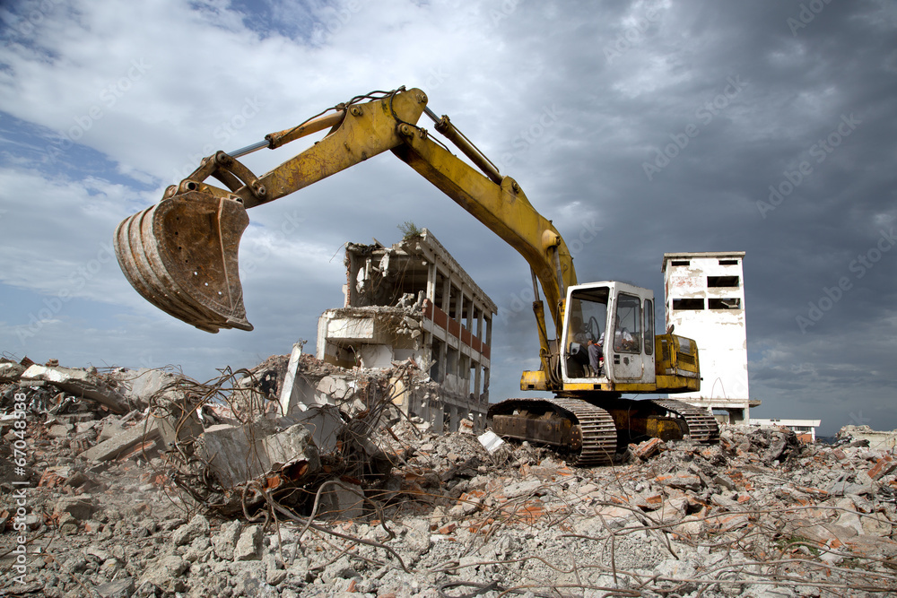 Bulldozer removes the debris from demolition of old buildings Stock ...