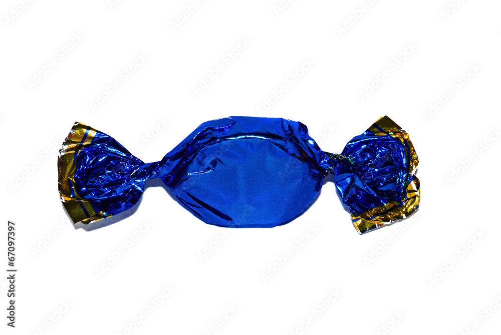 One candy in a dark blue shiny paper wrapper closeup Stock Photo ...