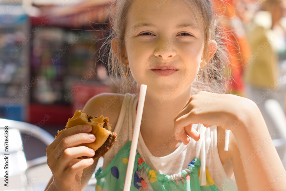 Girl having the lunch at a fast-food restaurant Stock Photo | Adobe Stock