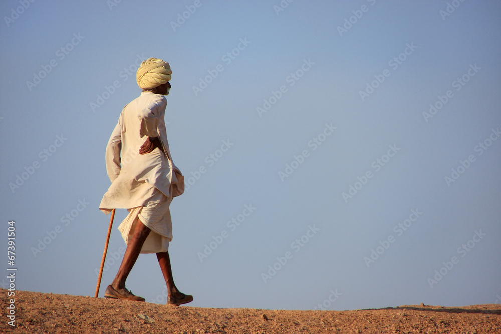 Local man walking on a hill, Khichan village, India Stock Photo | Adobe ...