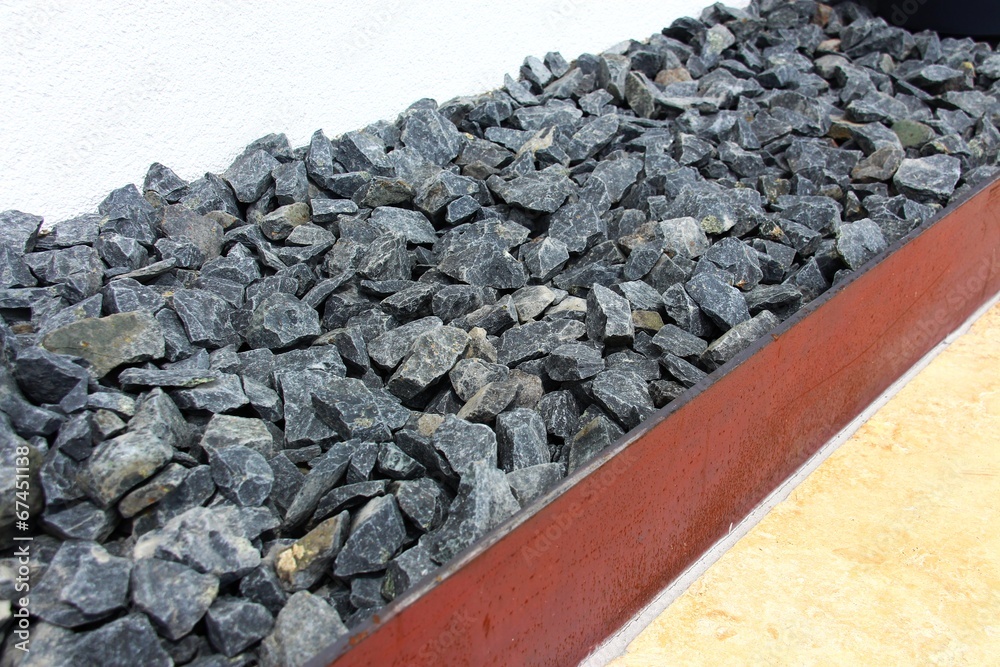 hauseinfassung mit basaltsteinen I Stock Photo | Adobe Stock