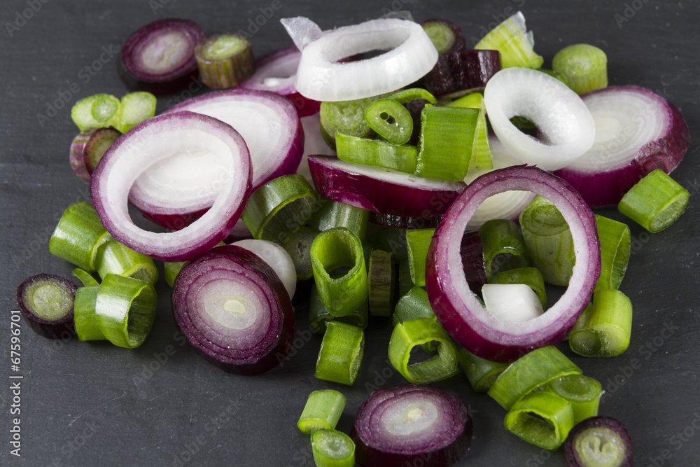 Slices of allum purple and green salad spring onions, scallions, Stock ...