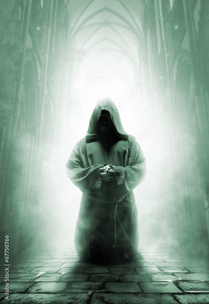 Praying medieval monk in dark temple corridor Stock Photo | Adobe Stock