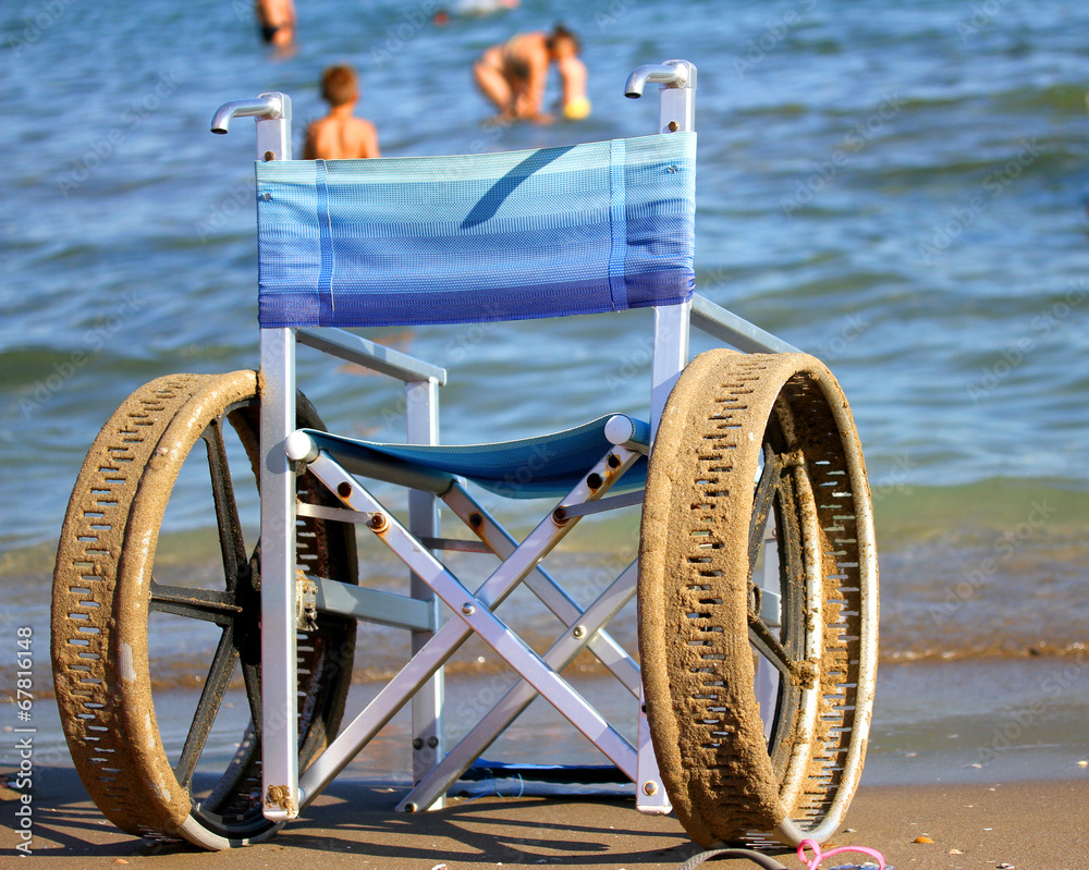 wheelchair with perforated wheels on the Sea Beach Stock Photo | Adobe ...