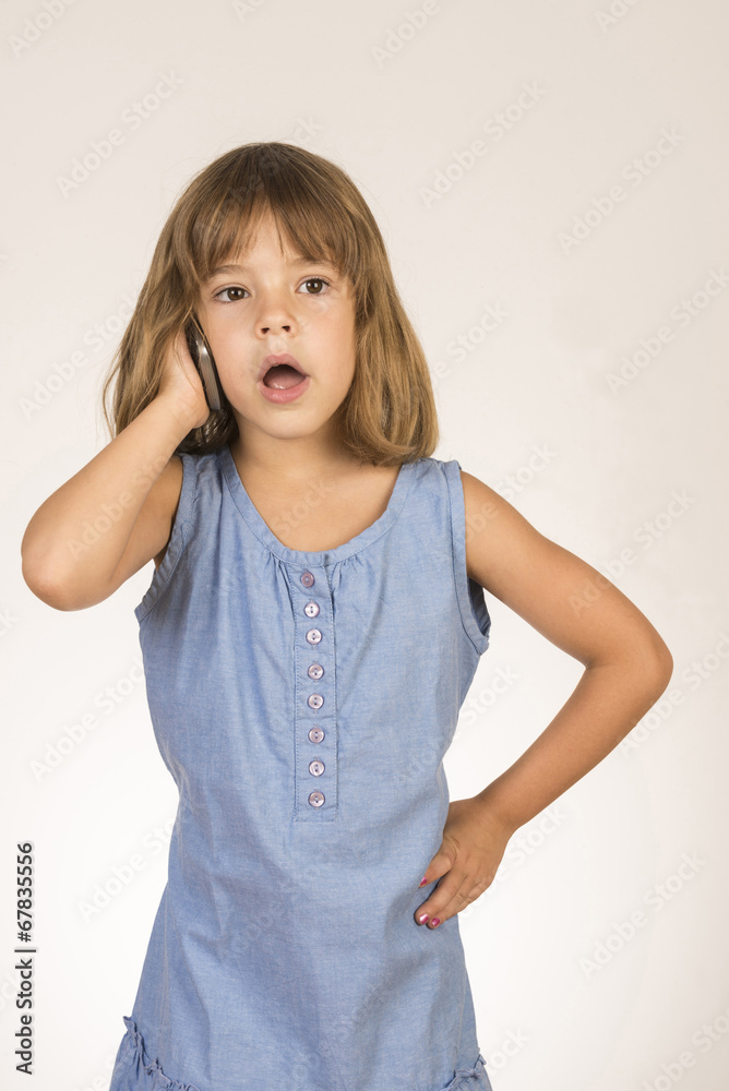 Little girl talking on the phone Stock Photo | Adobe Stock