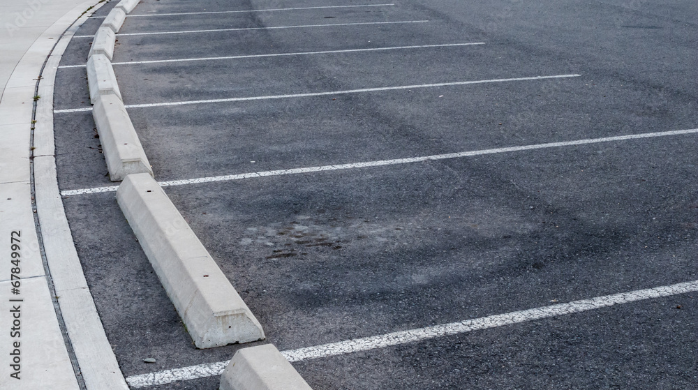 Curved parking spaces and curbs. Stock Photo | Adobe Stock