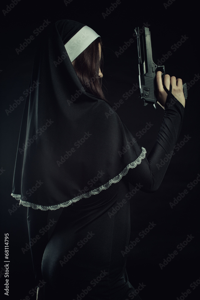 Nun with gun Stock Photo | Adobe Stock