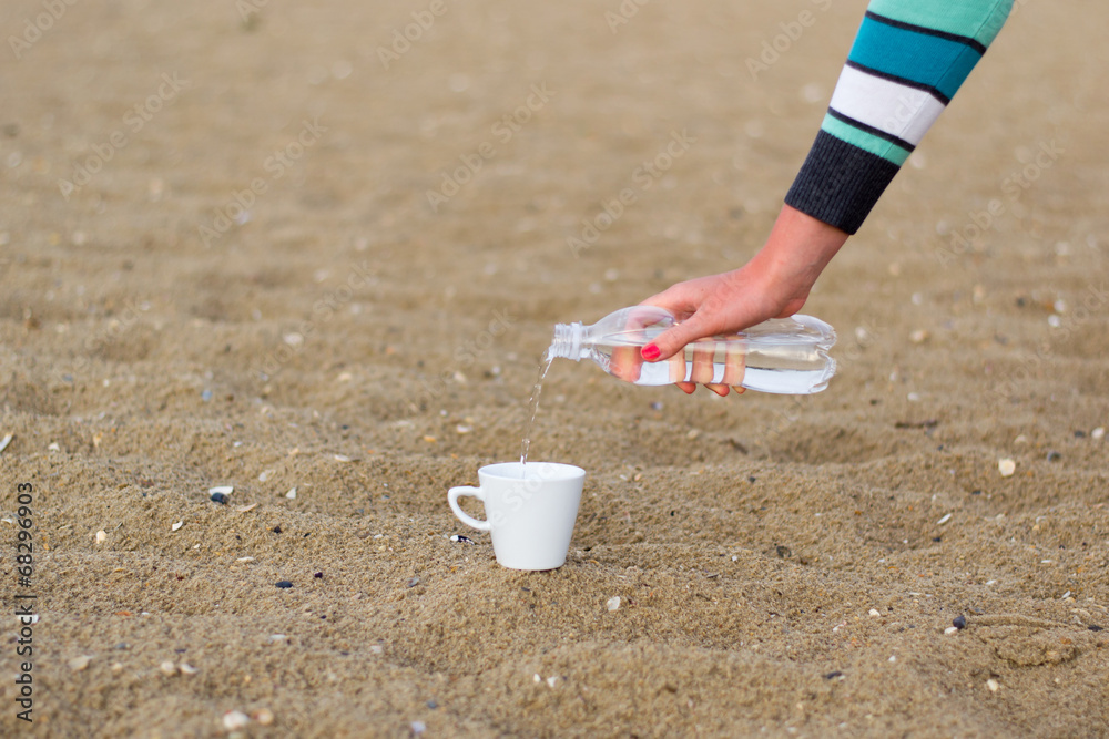 Sand And Water In A Cup