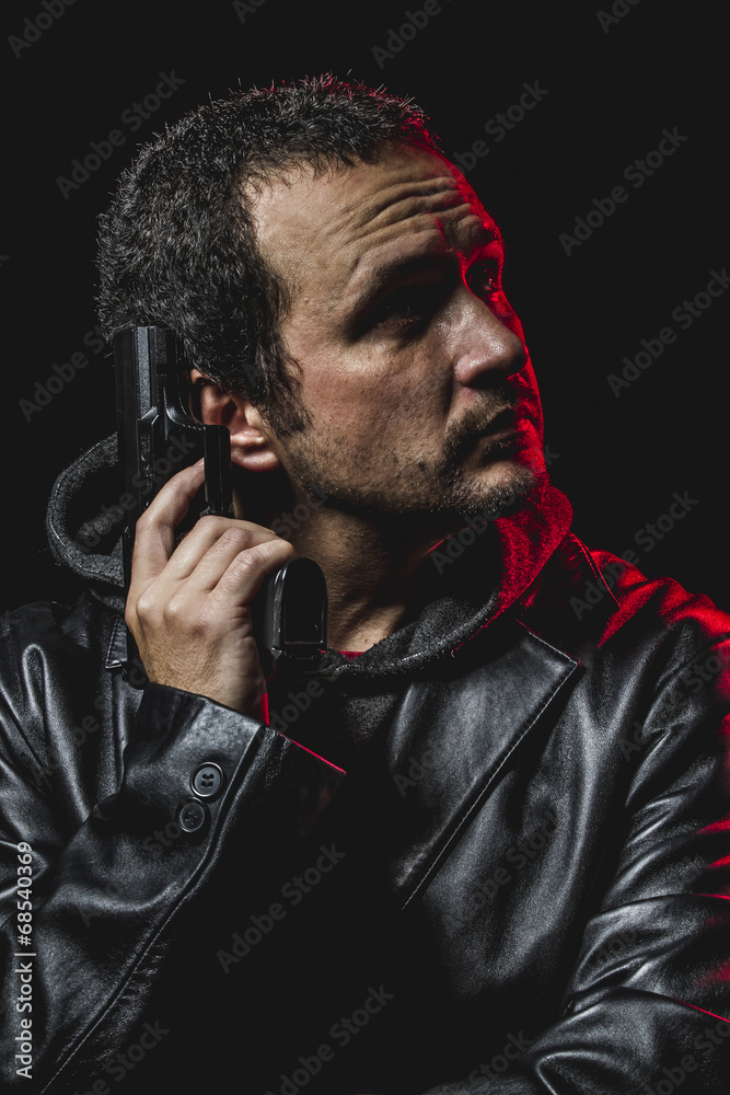 crime, thief with gun in hand. man in leather jacket Stock Photo ...