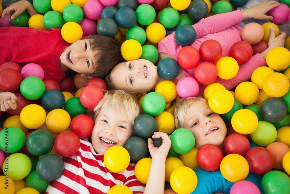 Happy children playing in ball pool Stock Photo | Adobe Stock