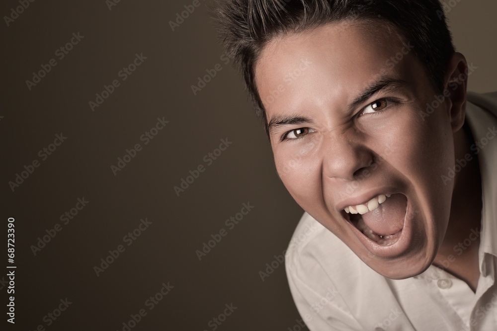 Laughing boy cring,shouting, screaming, hysteria on a brown back Stock ...