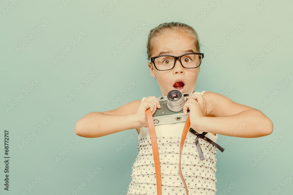 smiling child holding a camera Stock Photo | Adobe Stock