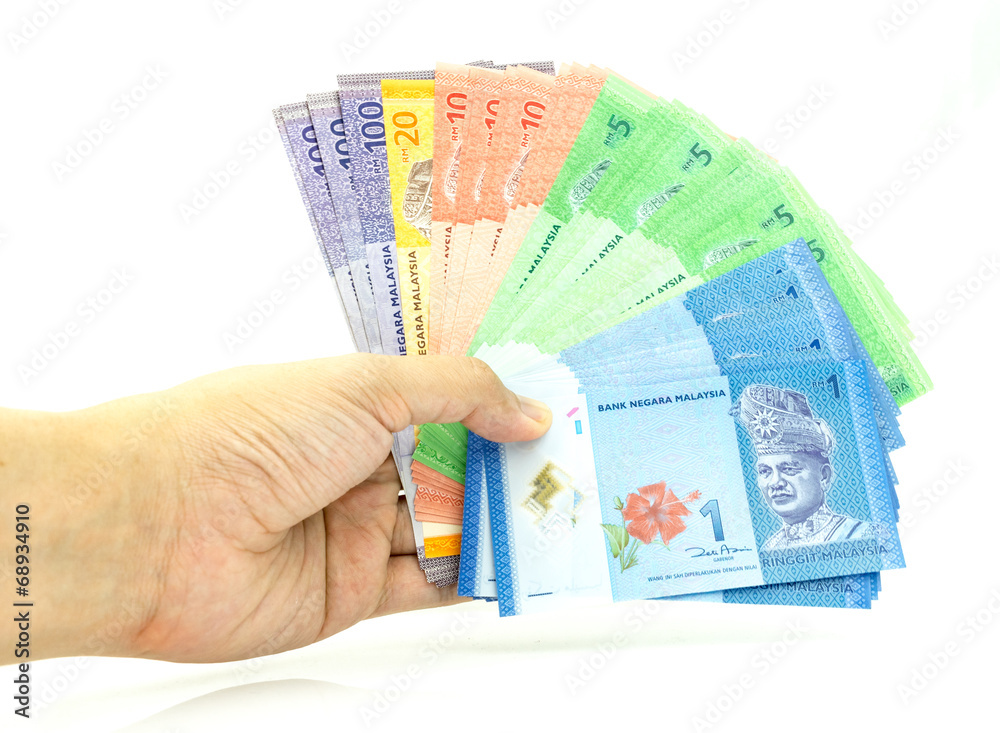 Hand holding lots of Malaysia Ringgit Currency Bank Notes Stock Photo ...
