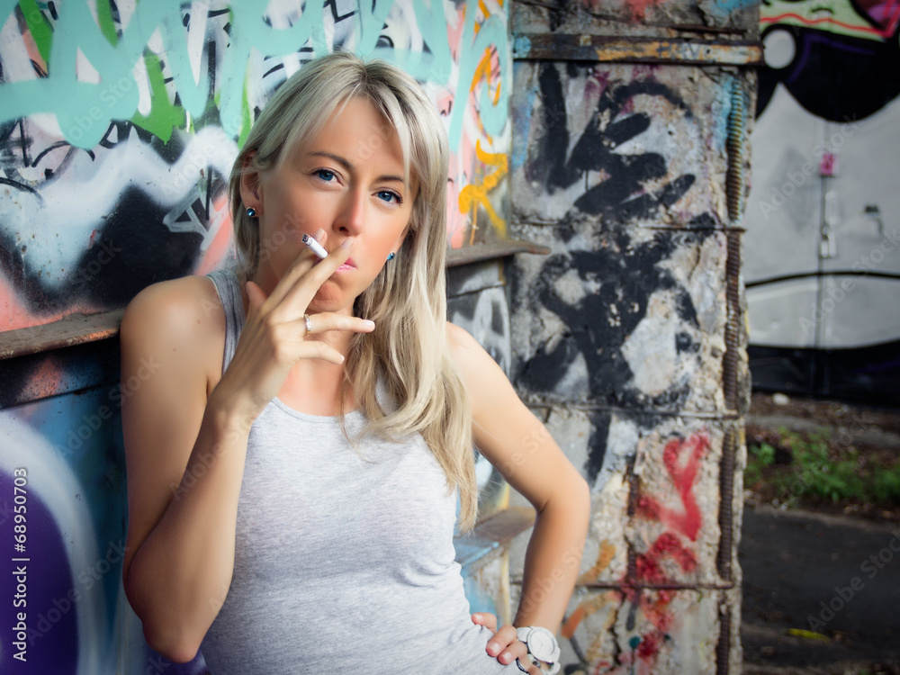 Addicted young girl smoking cigarette Stock Photo | Adobe Stock