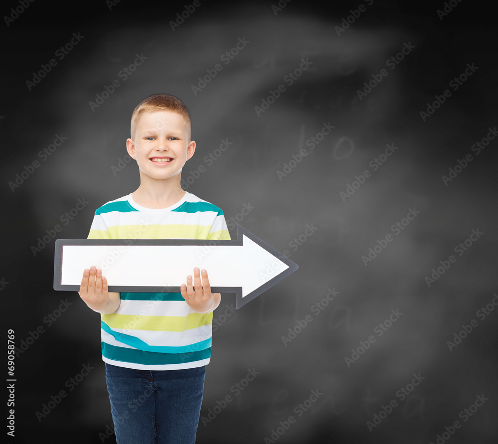 smiling little boy with blank arrow pointing right Stock Photo | Adobe ...