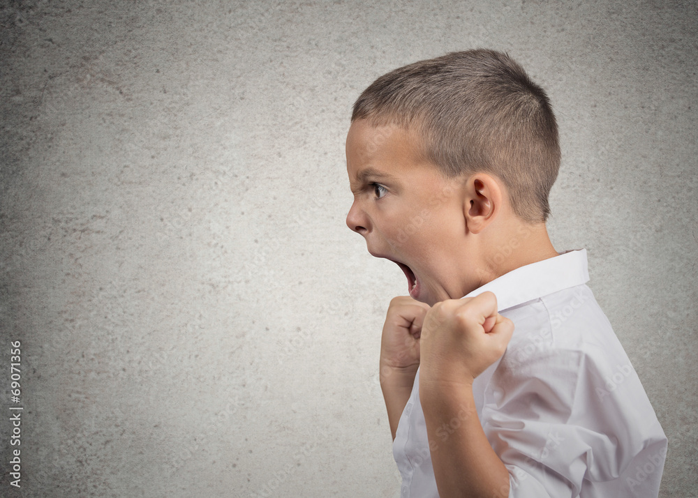 Angry Boy Screaming, side view profile, grey wall background Stock ...