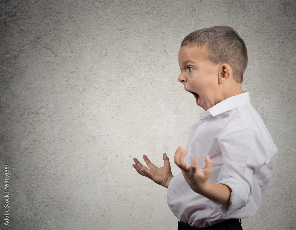 Angry Boy Screaming, side view profile, grey wall background Stock ...
