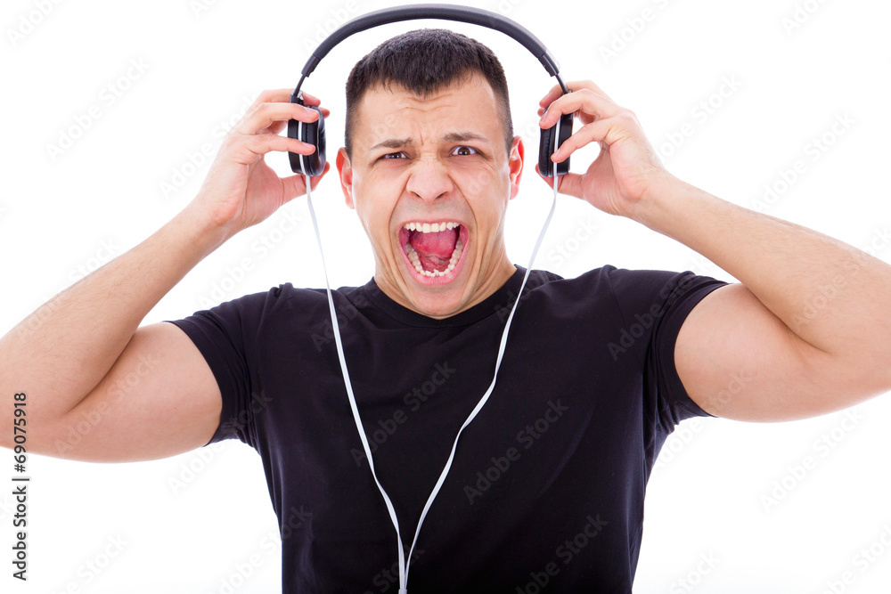 angry man yelling listening to loud music with headphones Stock Photo ...