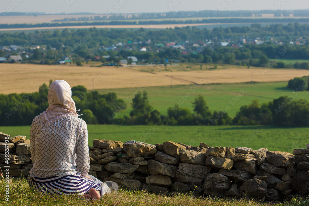 Young muslim woman praying outdoor Stock Photo | Adobe Stock
