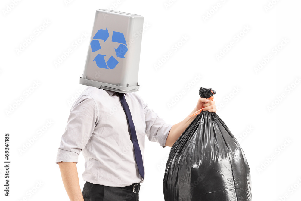 Man with a recycle bin over his head carrying a garbage bag Stock Photo ...
