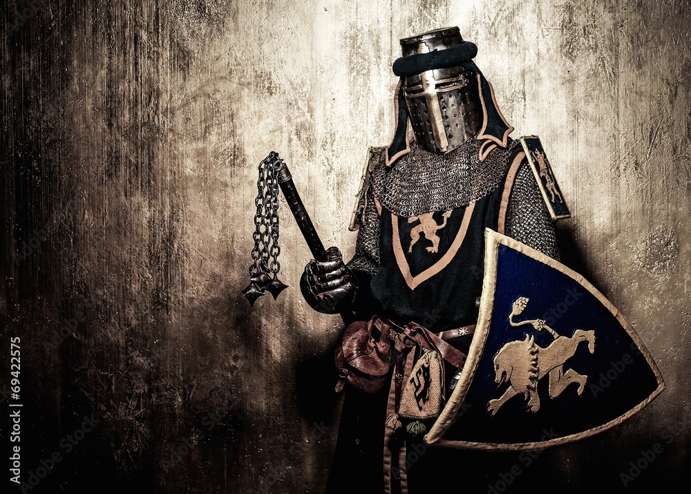 Medieval knight on golden wall background Stock Photo | Adobe Stock