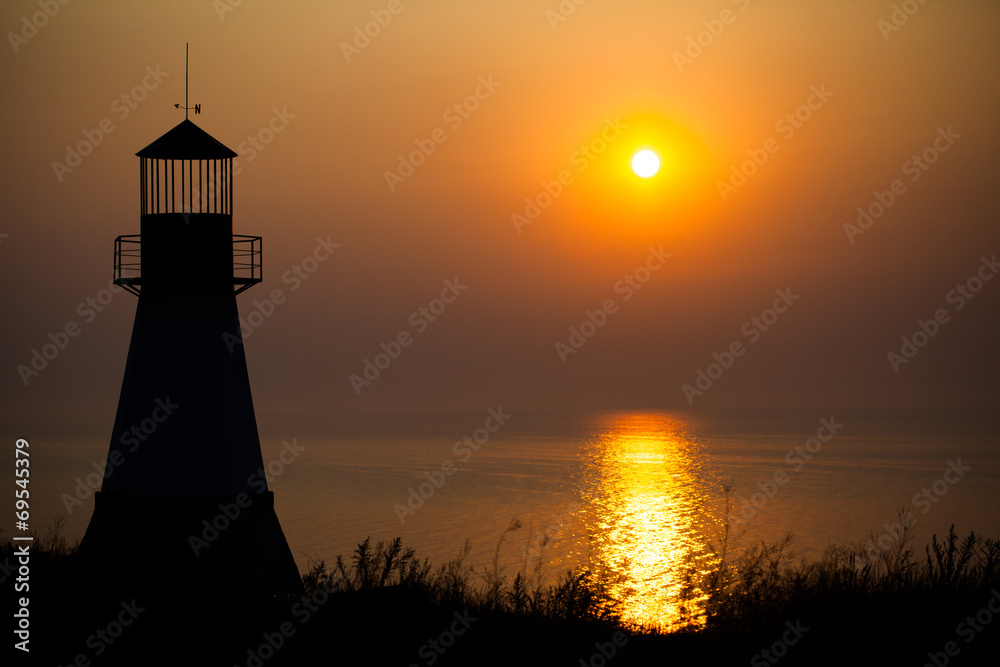 Lighthouse on sunset Stock Photo | Adobe Stock