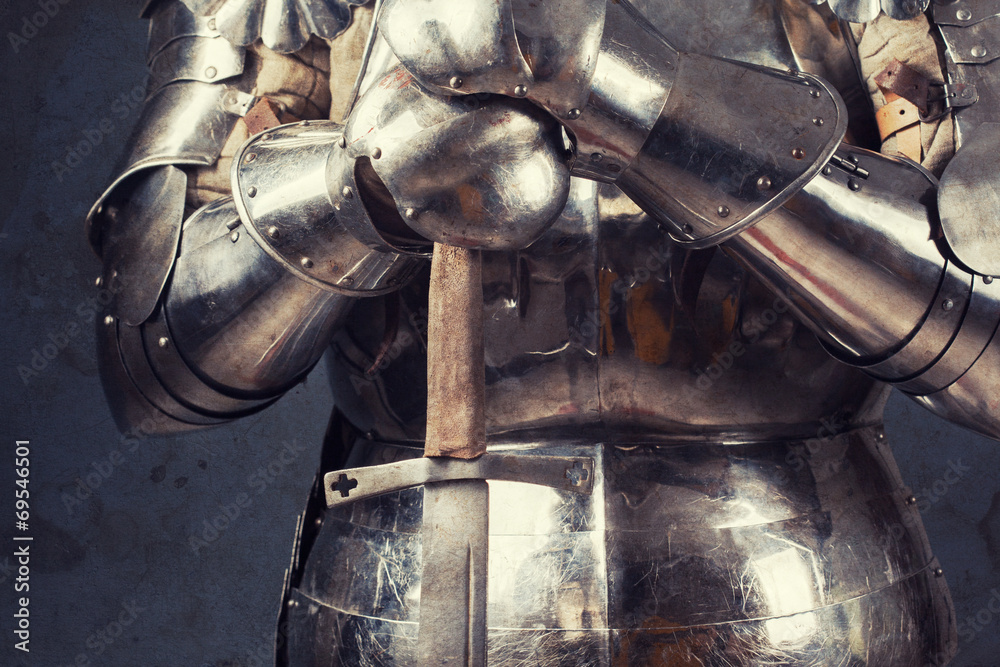 knight wearing armor and standing with two-handed sword Stock Photo ...