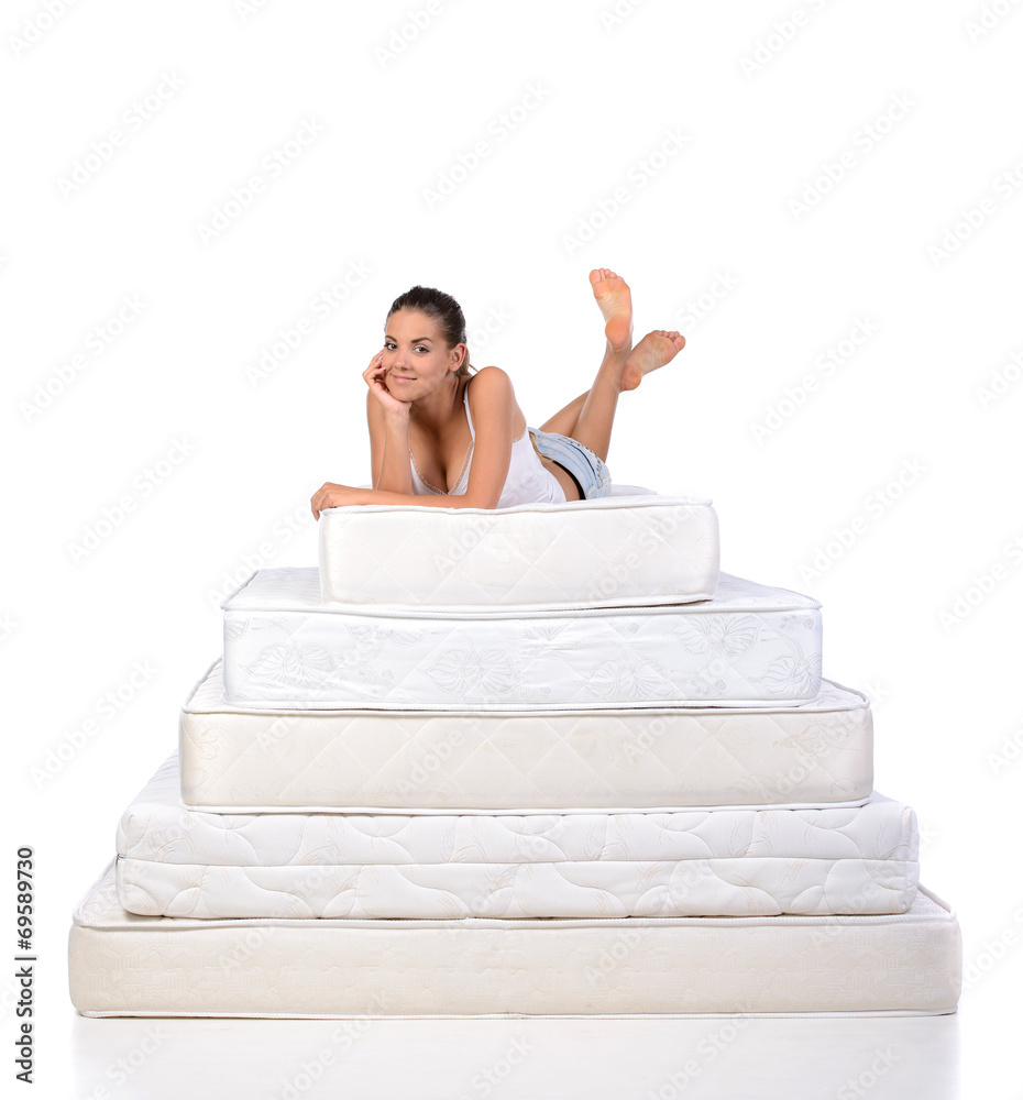 Woman and mattress Stock Photo | Adobe Stock