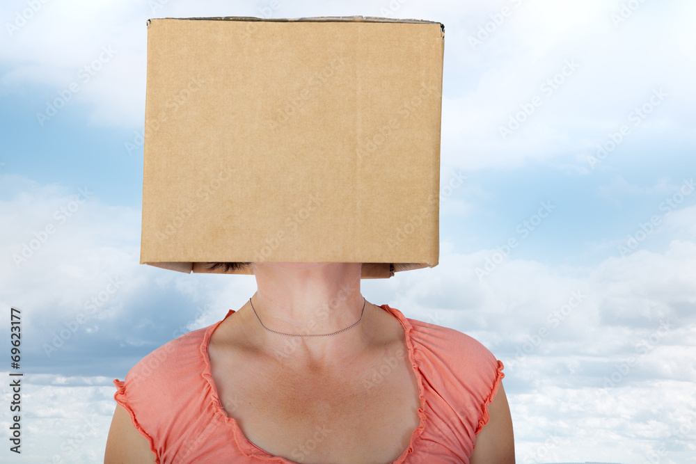 Woman has box with painted face on the head Stock-Foto | Adobe Stock