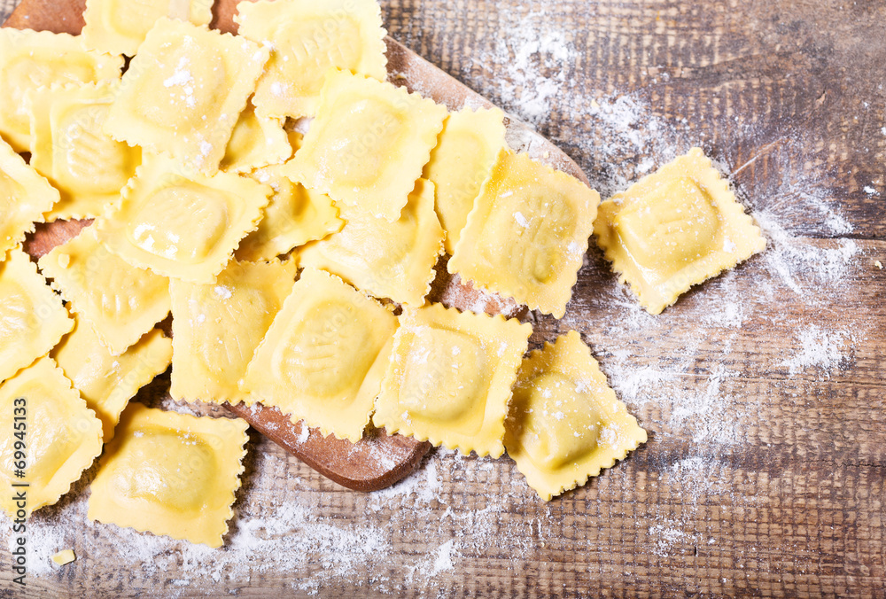 Raw ravioli with flour Stock Photo | Adobe Stock