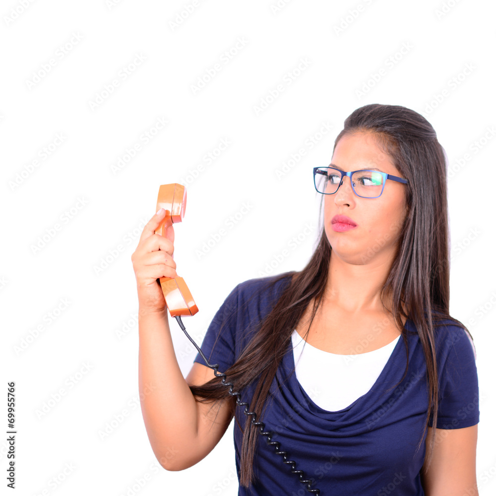 Portrait of young female in shock while talking on phone having Stock ...