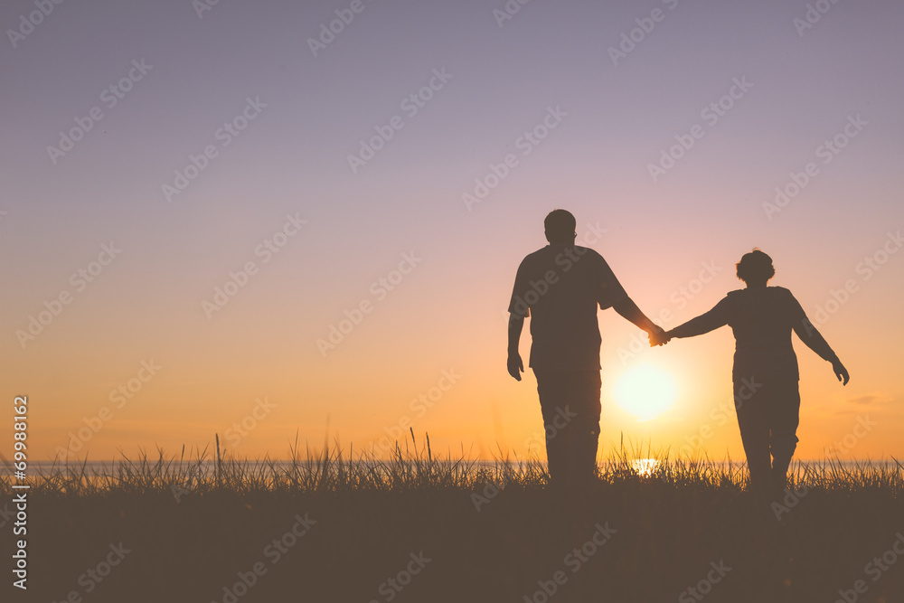 Senior couple holding hands silhouettes Stock Photo | Adobe Stock