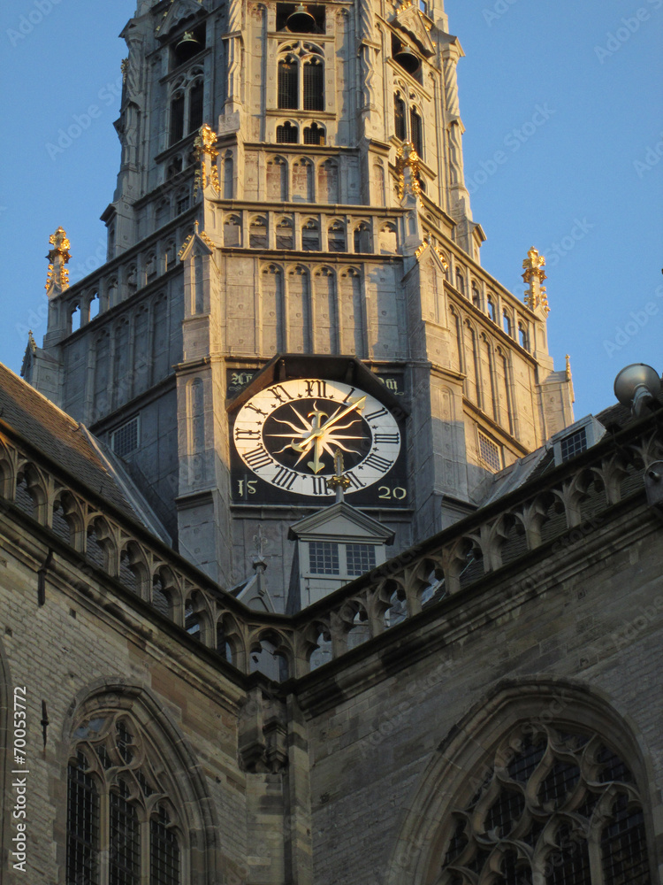 part of a church tower with the clock in the middle Stock Photo | Adobe ...